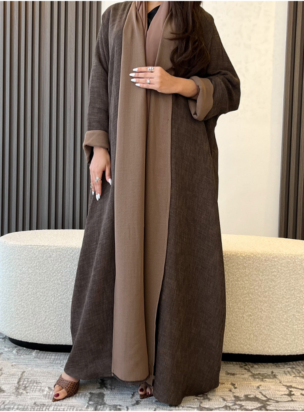 Colored abaya Colored abaya characterized by a gradient of brown colors ...