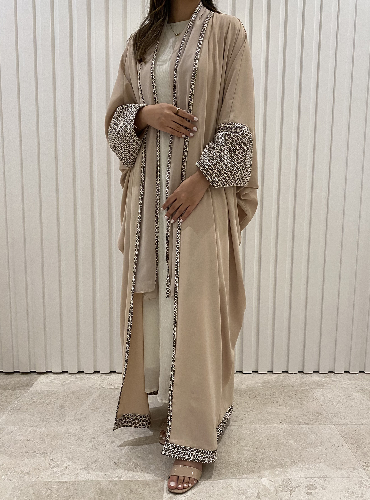 Beige Abaya 01 Beige abaya with patterned trimmings. Comes with a matching headscarf. Abayas ...
