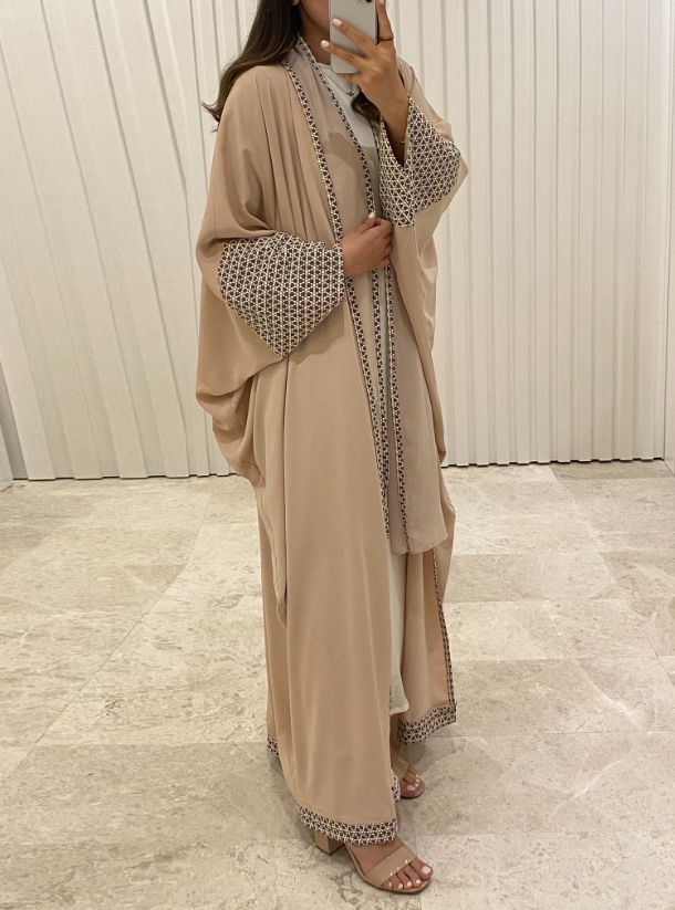 Beige Abaya 01 Beige abaya with patterned trimmings. Comes with a matching headscarf. Abayas ...