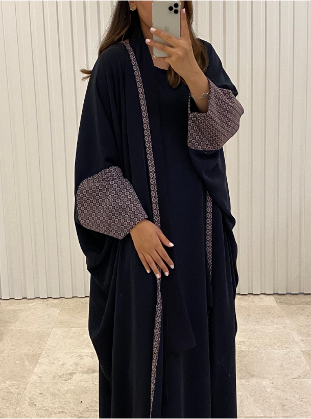 Navy Abaya 07 Navy blue abaya with patterned trimmings. Comes with a matching headscarf. Abayas ...