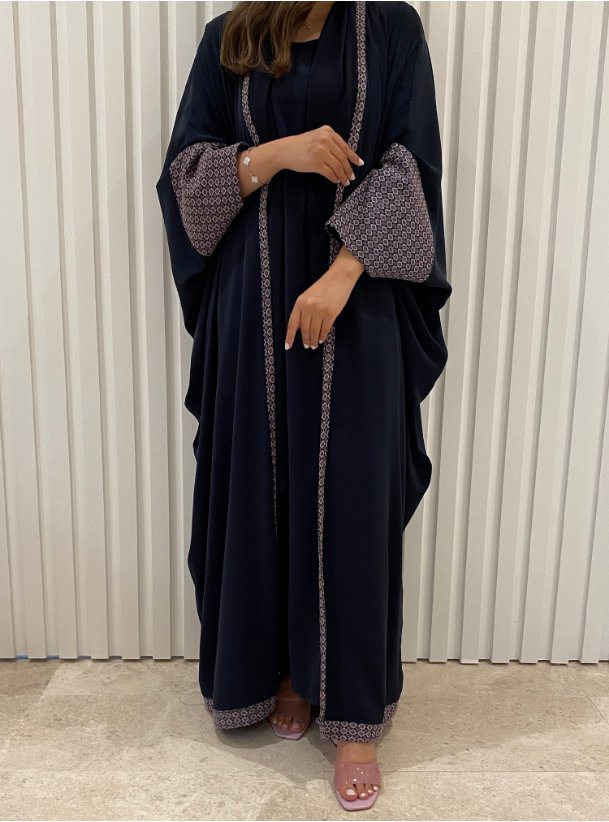 Navy Abaya 07 Navy blue abaya with patterned trimmings. Comes with a ...
