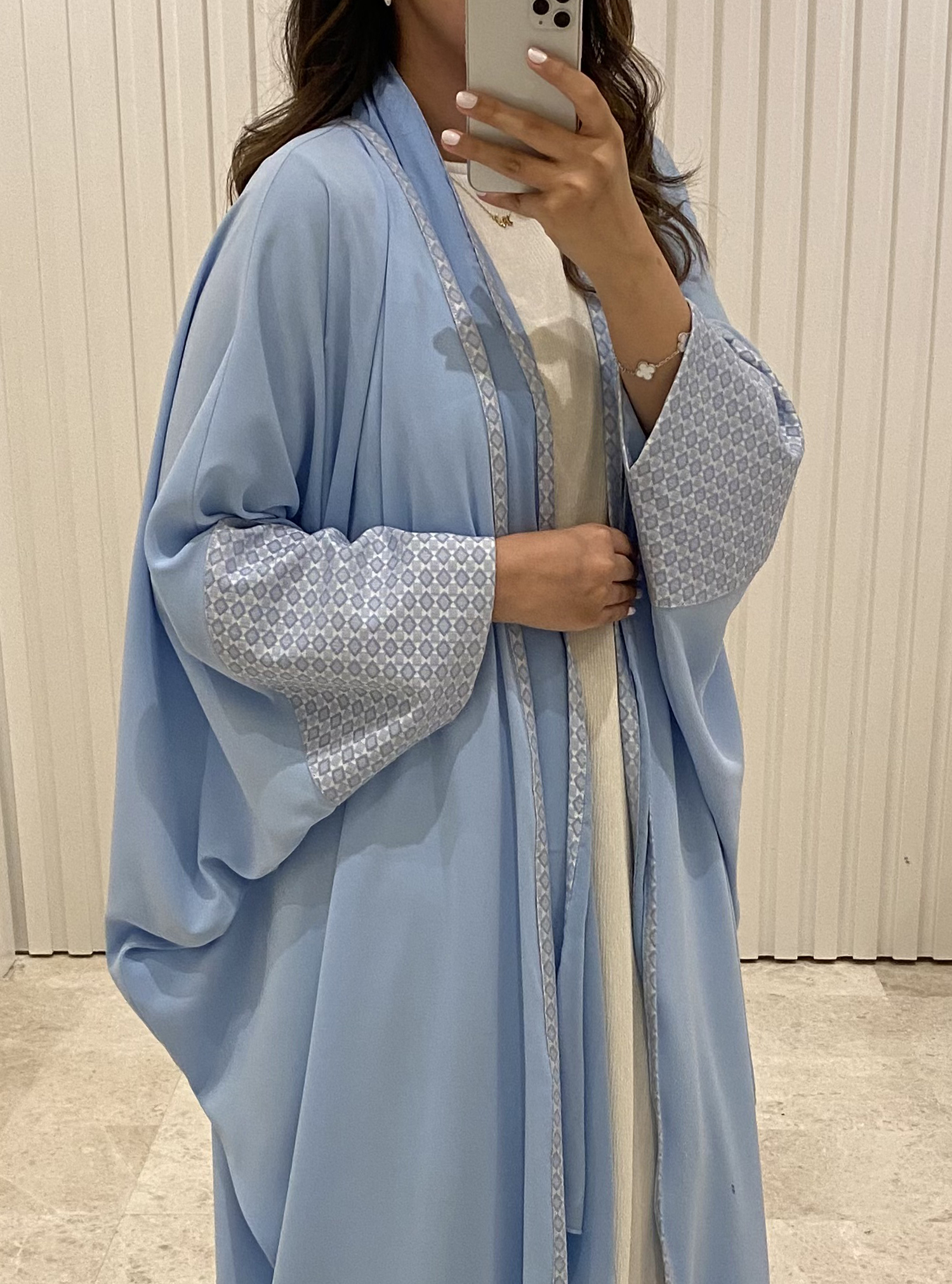 Blue Abaya 09 Light blue abaya with patterned trimmings. Comes with a ...