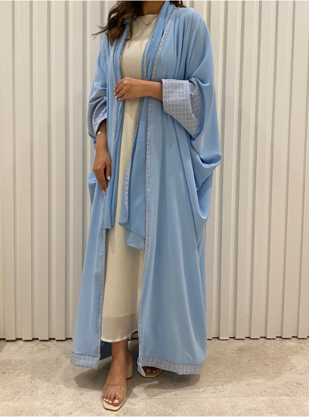 Blue Abaya 09 Light blue abaya with patterned trimmings. Comes with a ...