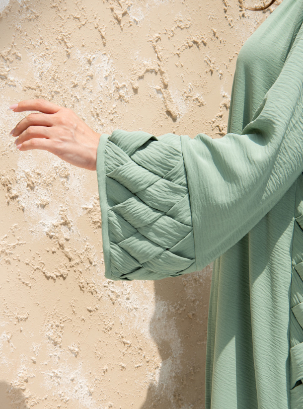 Beryl Abaya Beryl green abaya, features a weave-trimmed design. Comes with a matching headscarf ...