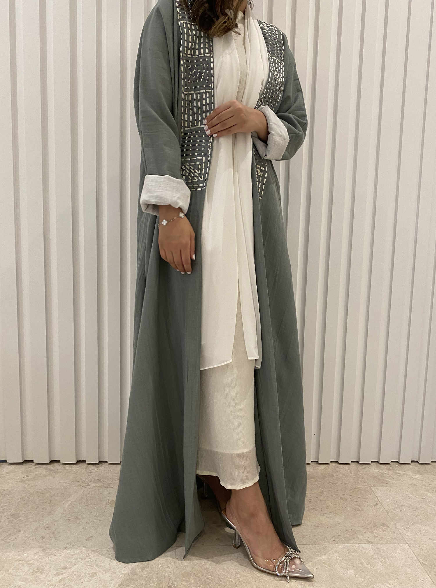 Grey Abaya 16 Grey abaya with embroidered neckline. Comes with a white headscarf. Abayas from ...