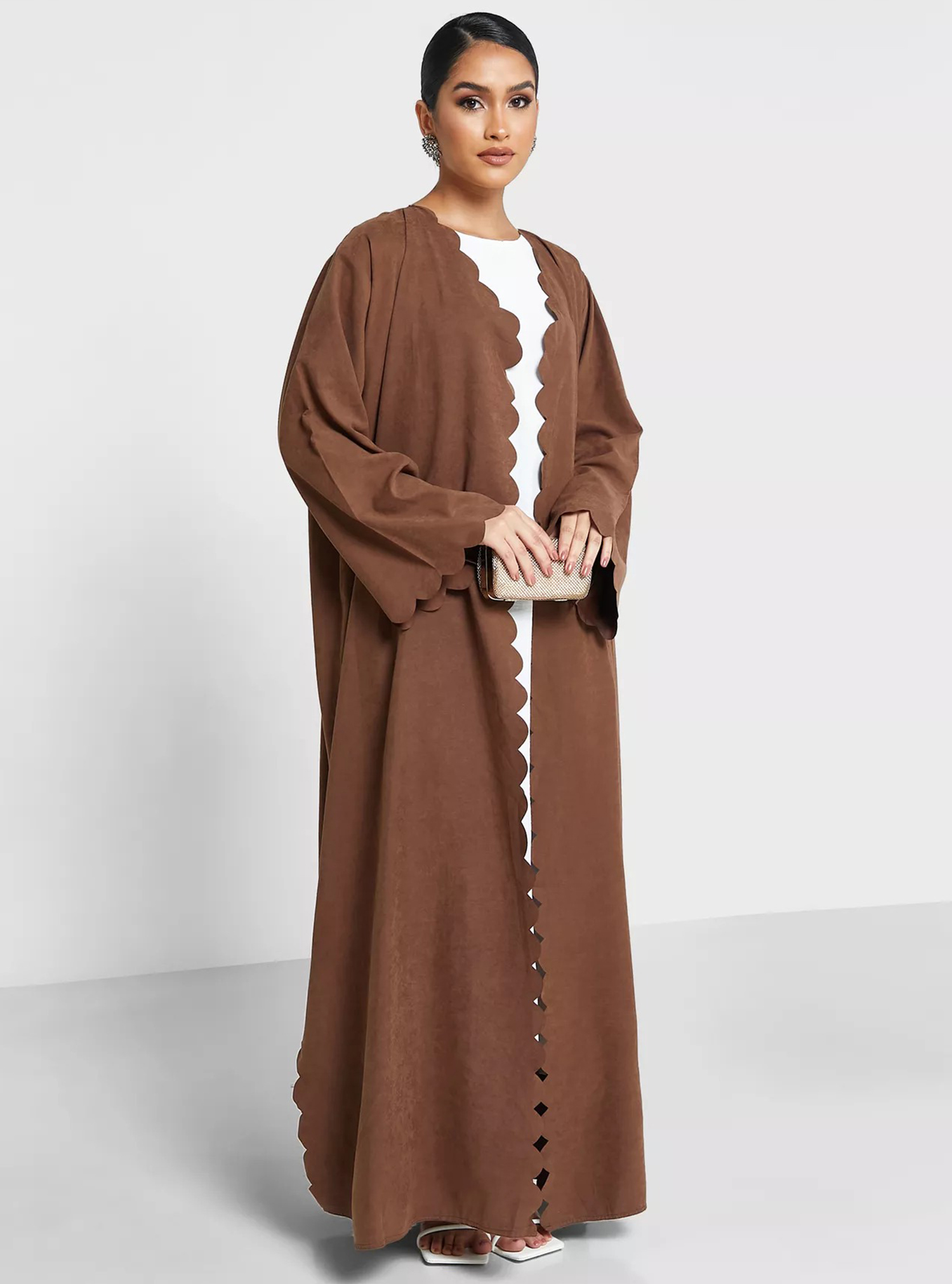 L01 Brown Abaya Brown abaya with scallop trimmings. Comes with matching headscarf. Abayas from ...