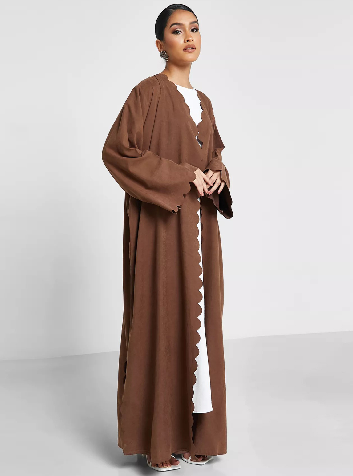 L01 Brown Abaya Brown abaya with scallop trimmings. Comes with matching headscarf. Abayas from ...