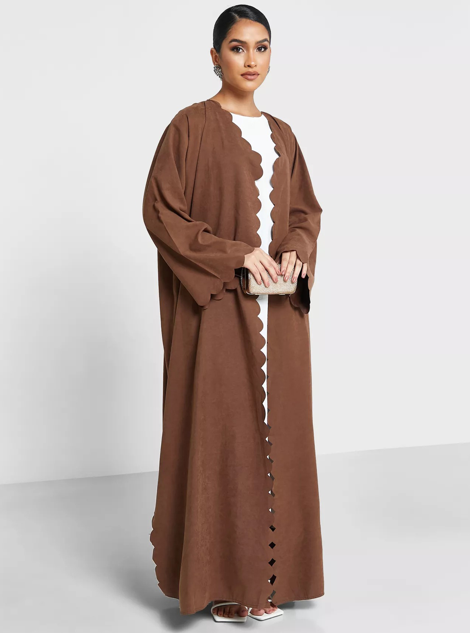 L01 Brown Abaya Brown abaya with scallop trimmings. Comes with matching headscarf. Abayas from ...