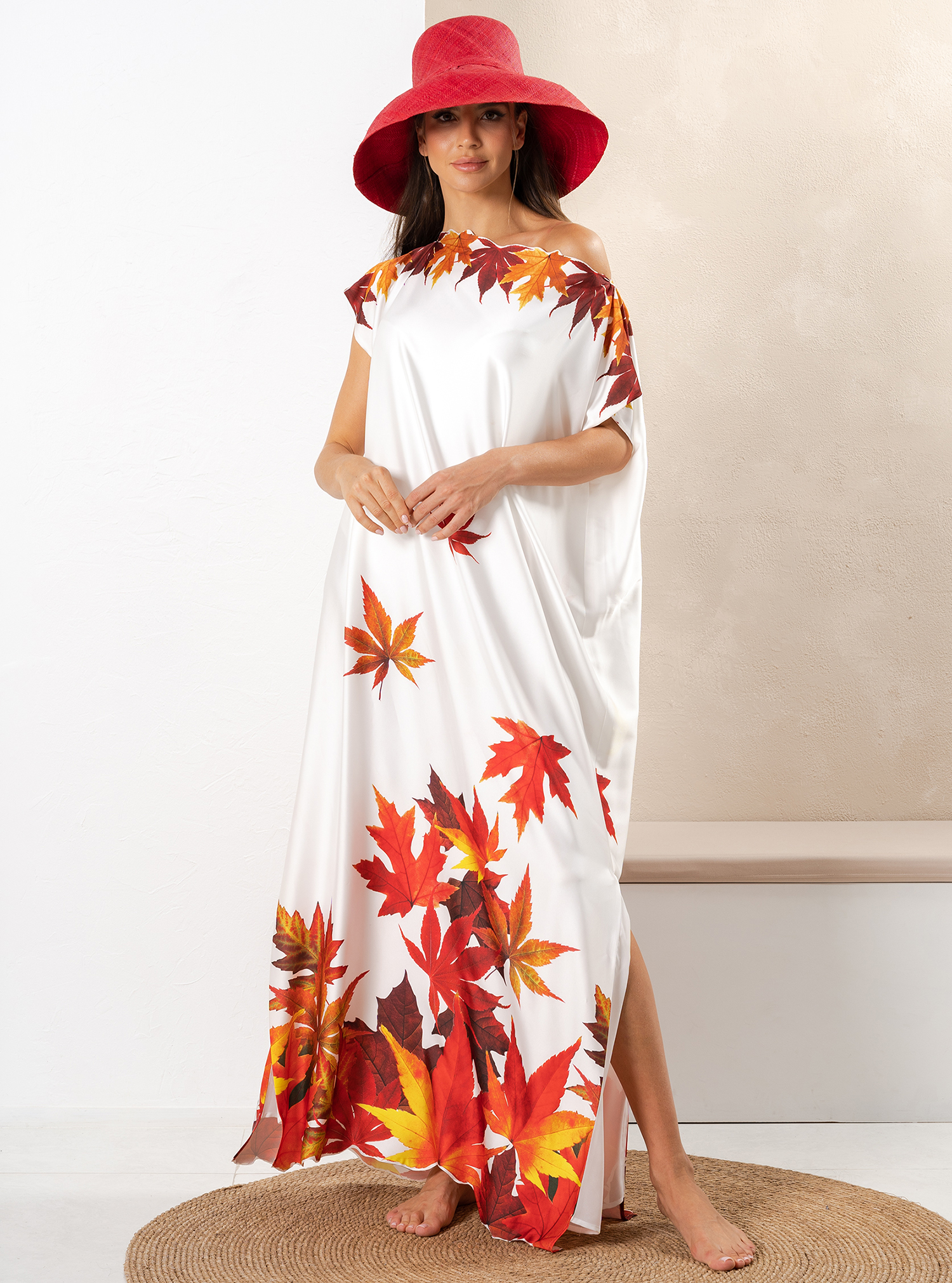ALLONIA A straight cut caftan with a collar bateau style, open on the ...