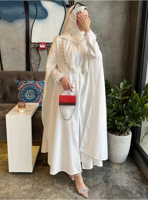 Bride abaya White luxe abaya with embellished collar and feather sleeve trimmings and attached ...