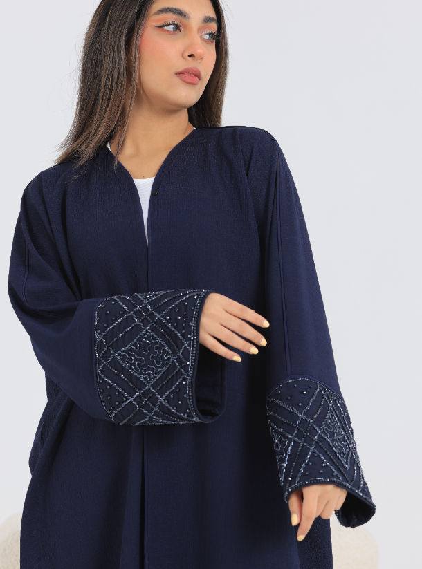 Navy Abaya Navy abaya adorned with delicate embellishments on the ...