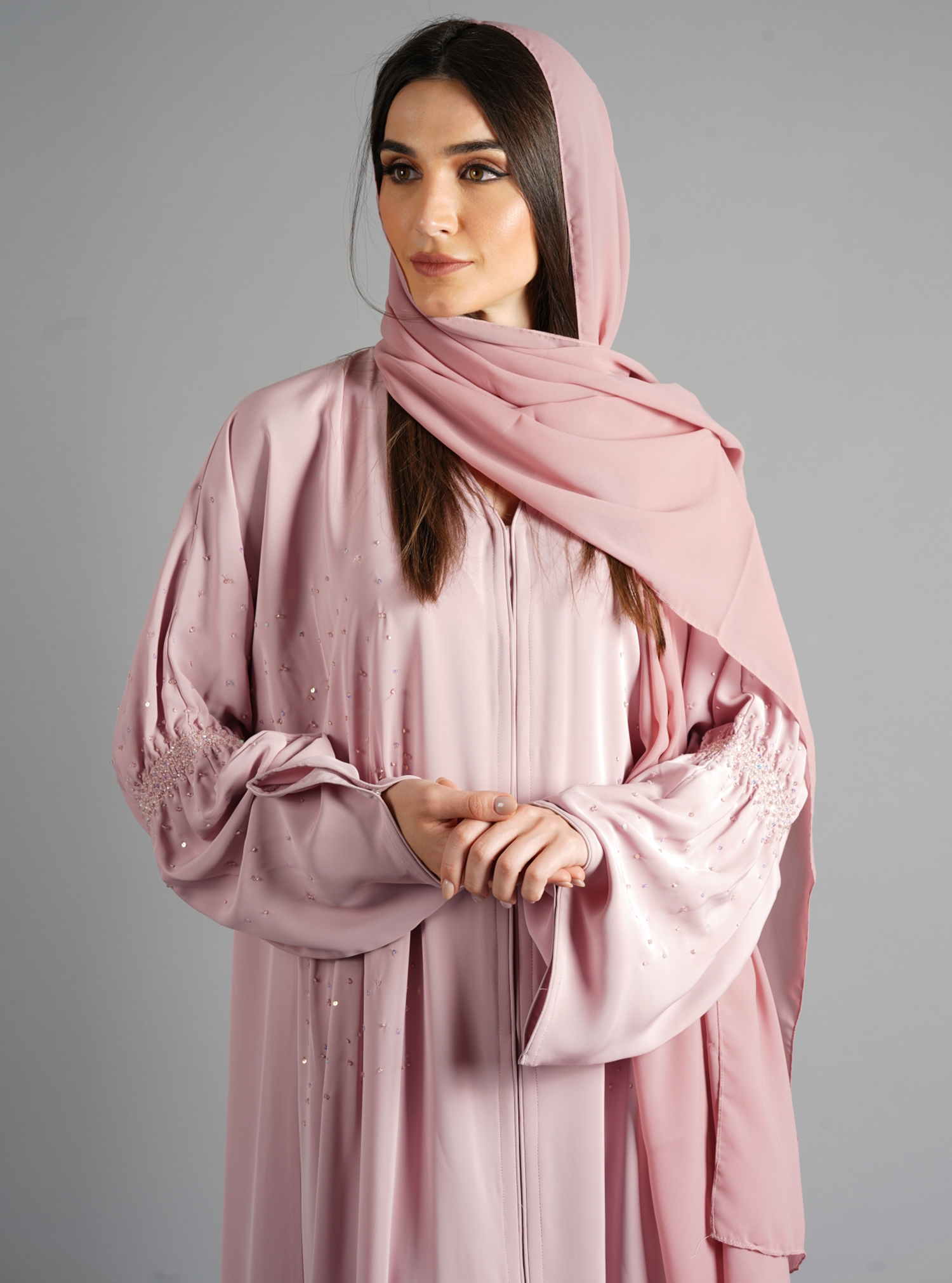Pink abaya Pink embellished abaya with smocked details. Comes with a ...