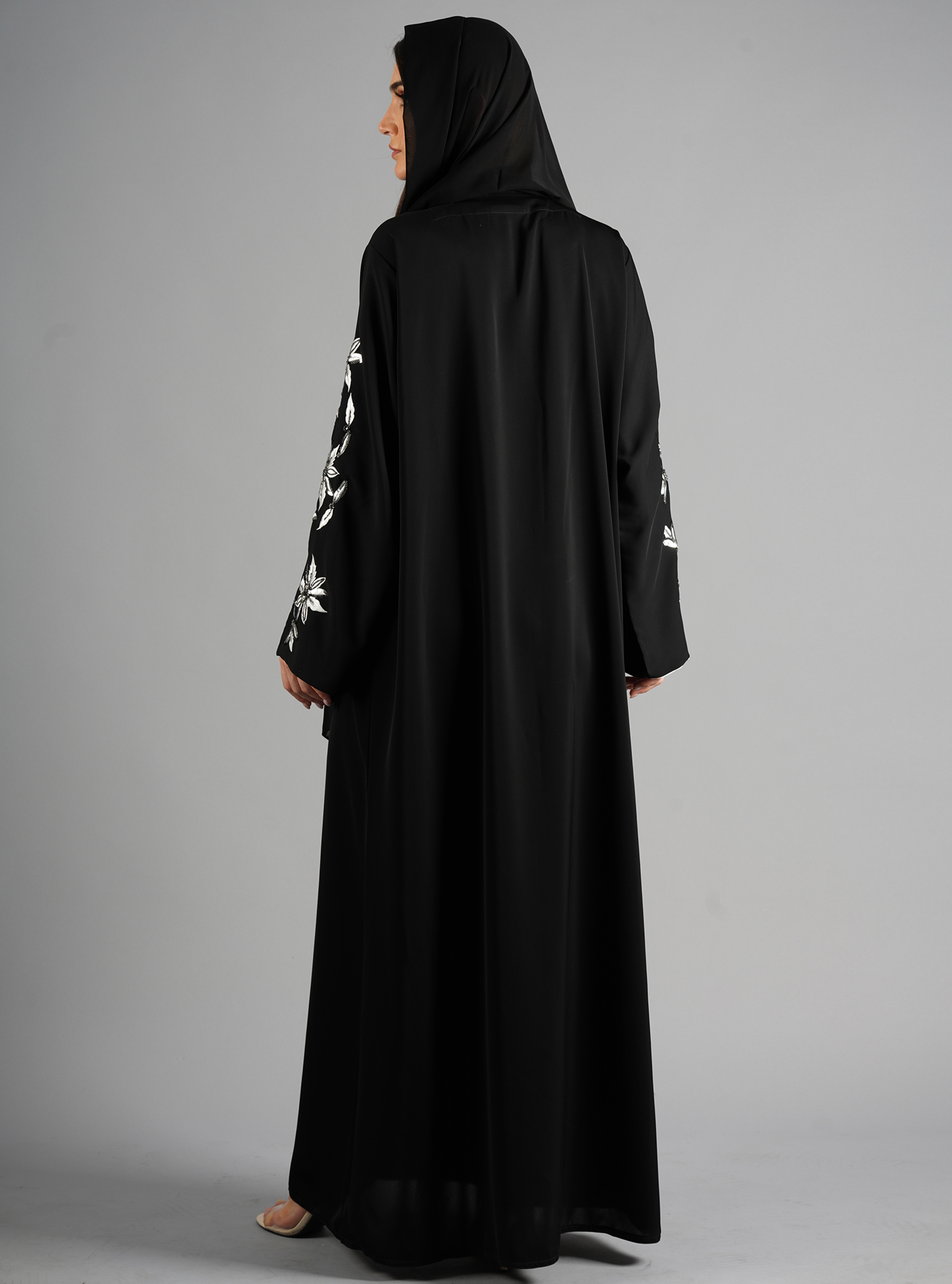 Black Flower Black abaya with floral embroidery, adorned with ...