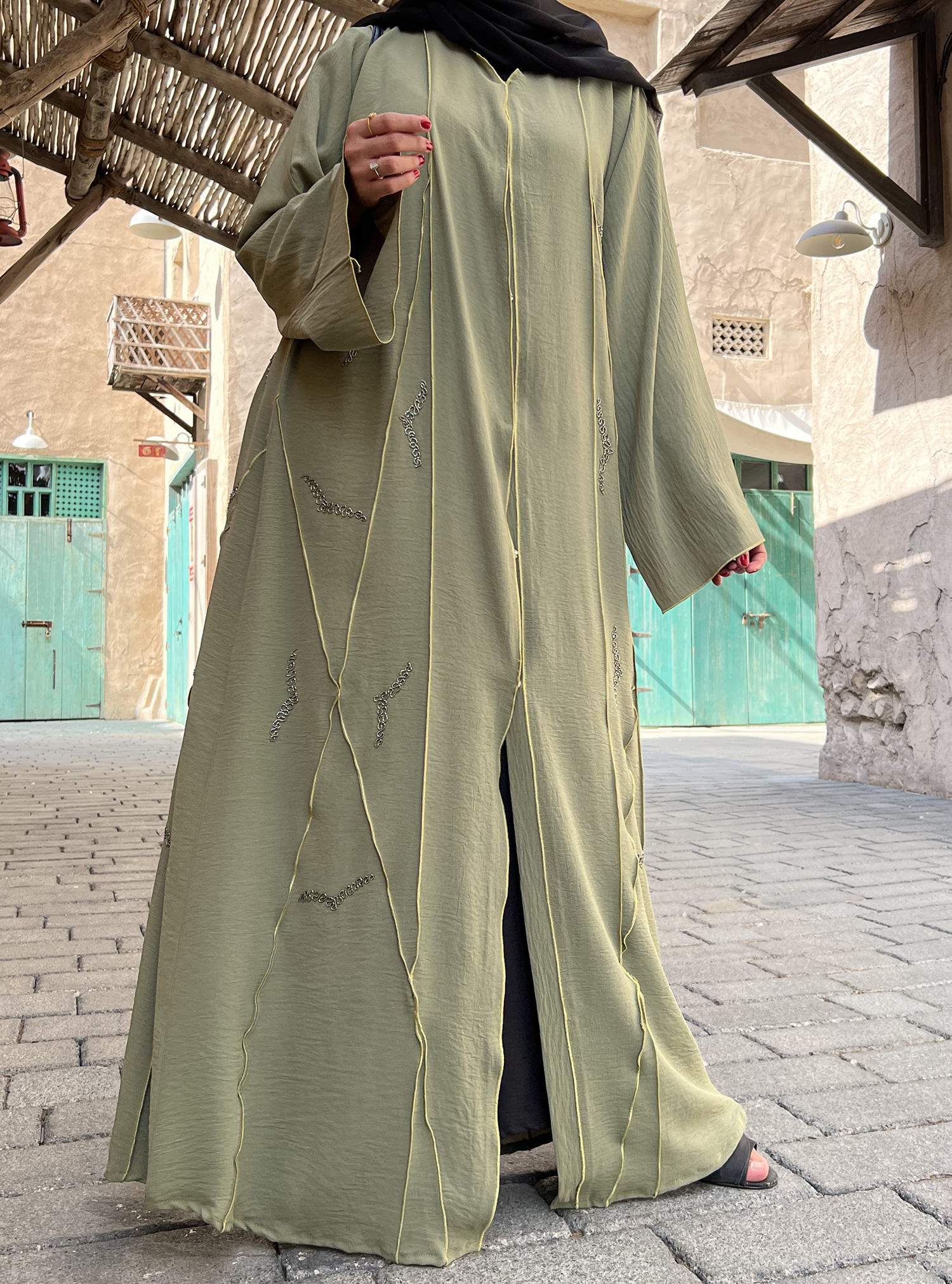 Sage Abaya Sage green abaya with contrast trimmings and embellishments. Comes with a matching ...