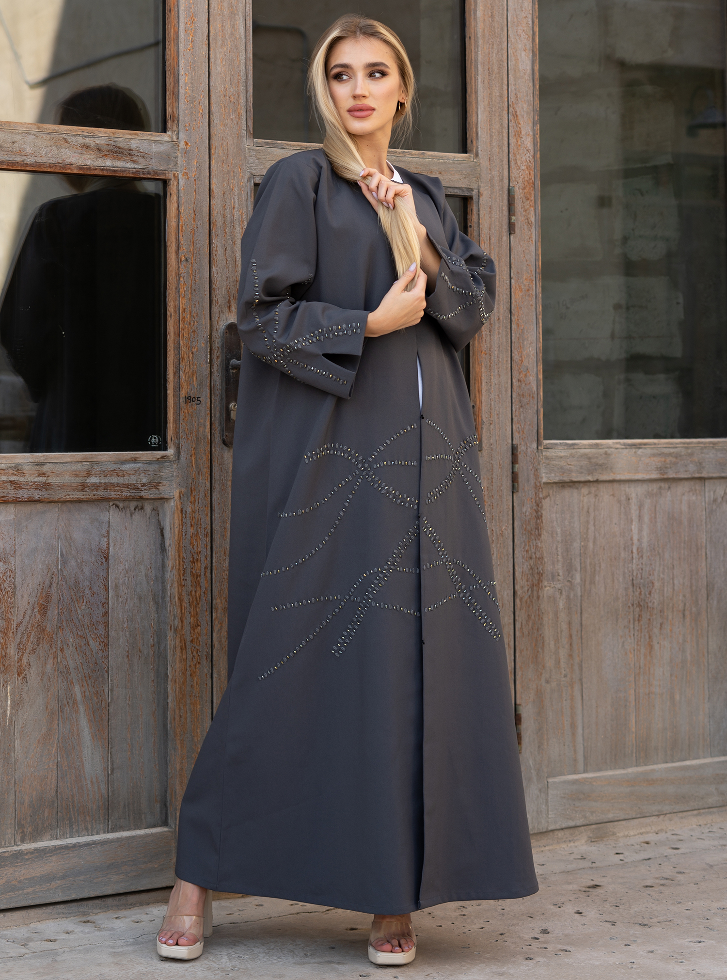 Grey abaya Grey abaya with monochromatic stitches adorned with embellishments. Abayas from ALIA ...