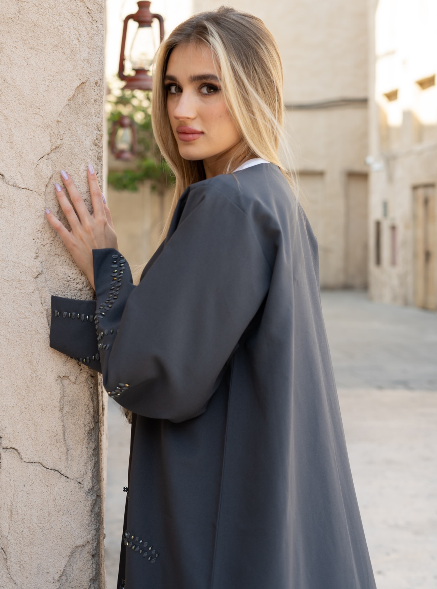 Grey abaya Grey abaya with monochromatic stitches adorned with embellishments. Abayas from ALIA ...