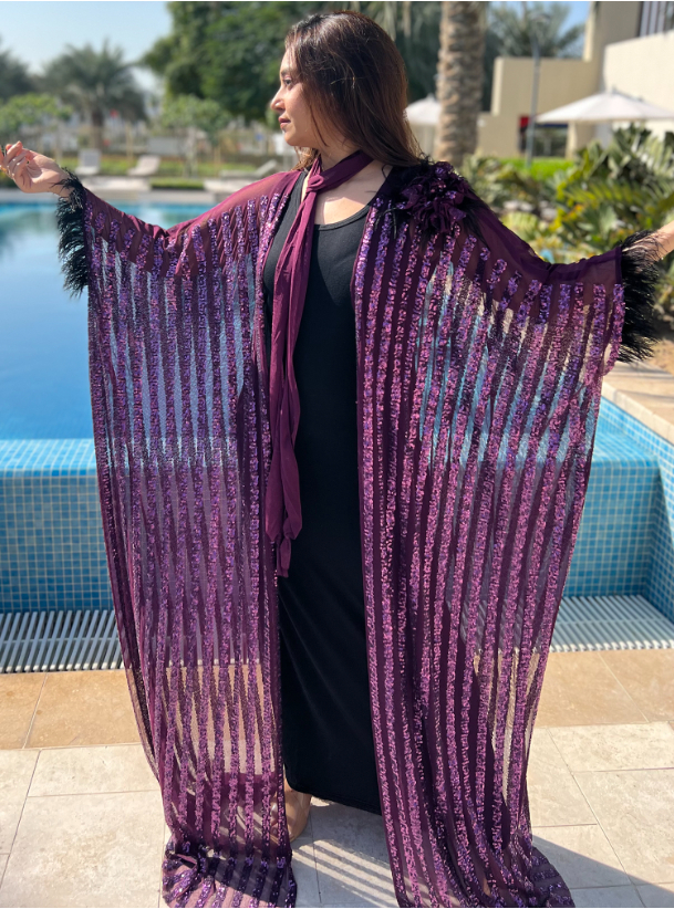 Bling purple Sequined purple abaya with flower brooch applique and feather trimmings. Abayas ...
