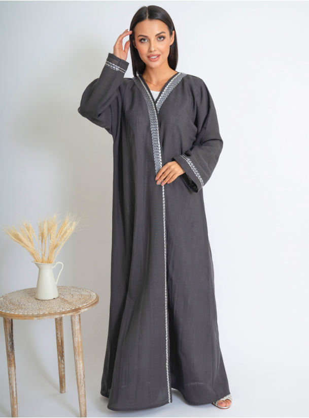 Grey abaya Grey Abaya with embroidered trimmings. Abayas from ALIA ABAYAA at Boksha