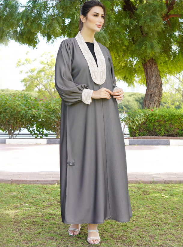 A-29 Abaya Dark grey collar abaya with cuffed sleeves, adorned with embellishments. Comes with a ...