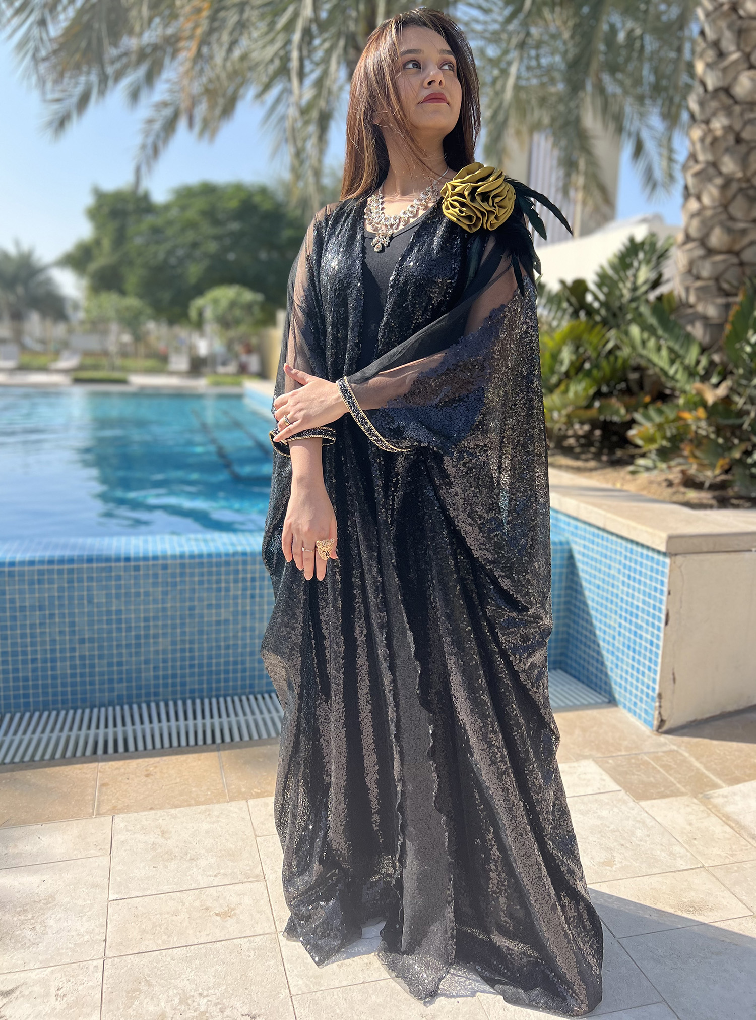 Bling black Sequined black abaya with sequins and flower brooch applique. Abayas from Roua ...