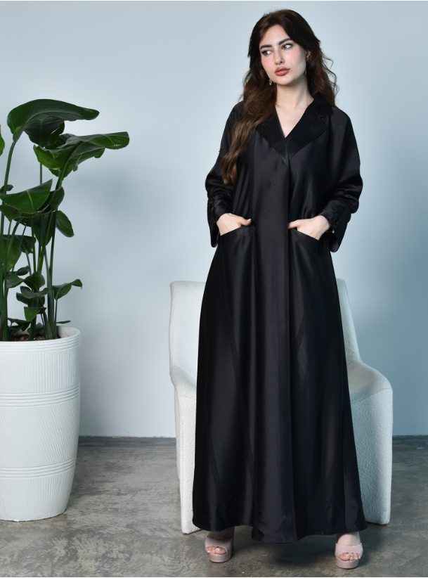 M18 Abaya Black collared abaya with pockets and stripe detail. Comes with a headscarf. Abayas ...