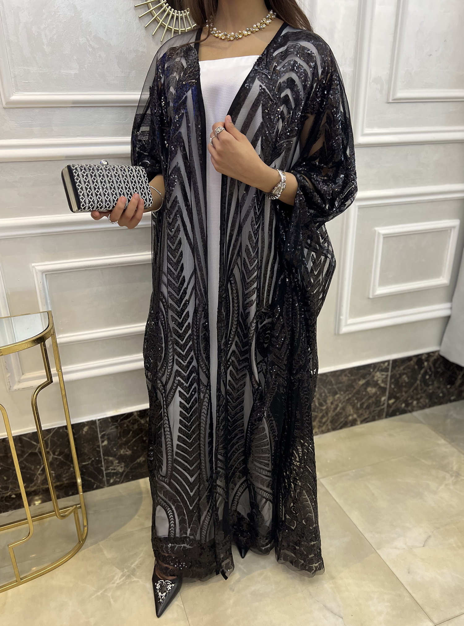 Sequined Abaya Black fully-sequined sheer abaya for Eid. Comes with a headscarf. Abayas from ...