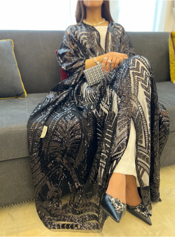 Sequined Abaya Black fully-sequined sheer abaya for Eid. Comes with a headscarf. Abayas from ...