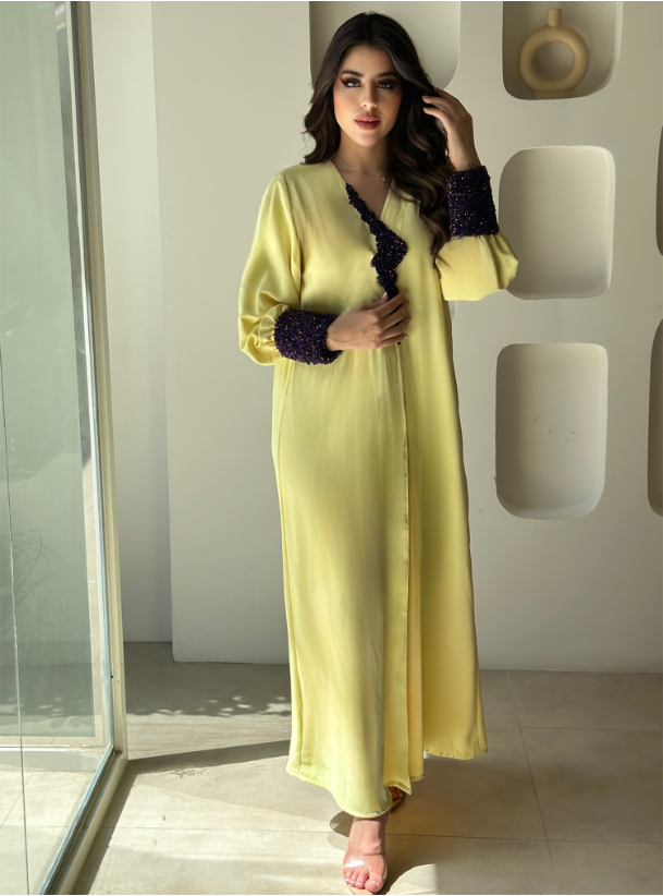 Yellow Abaya Yellow abaya with cuffed sleeves, adorned with ...