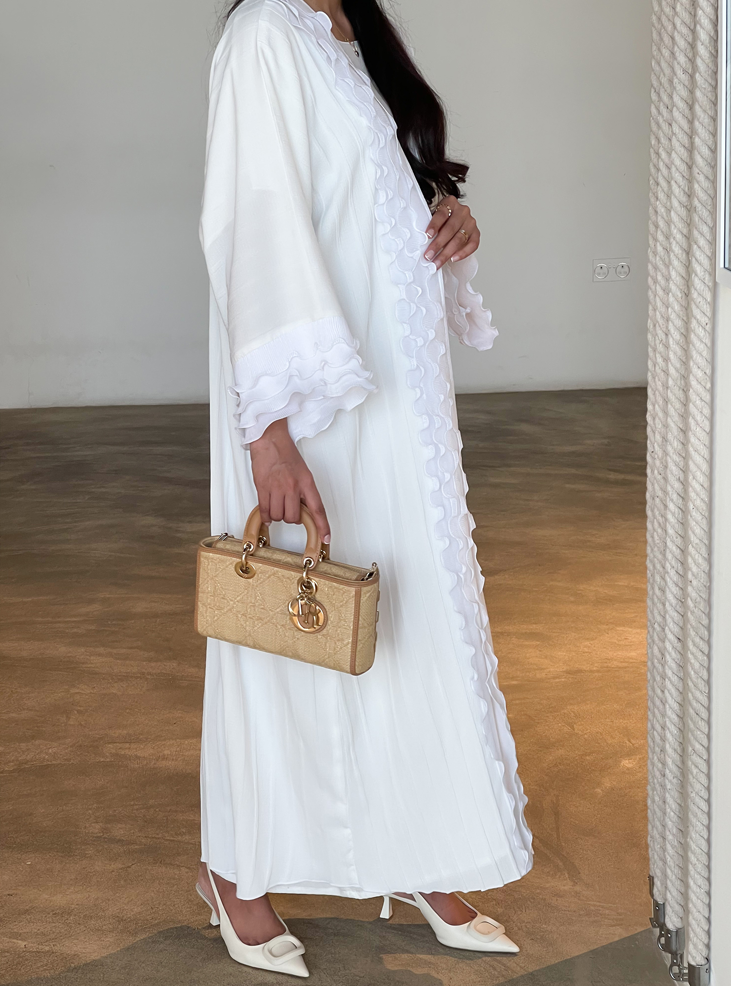 White Abaya White abaya with pleated lace trimmings. Comes with a ...