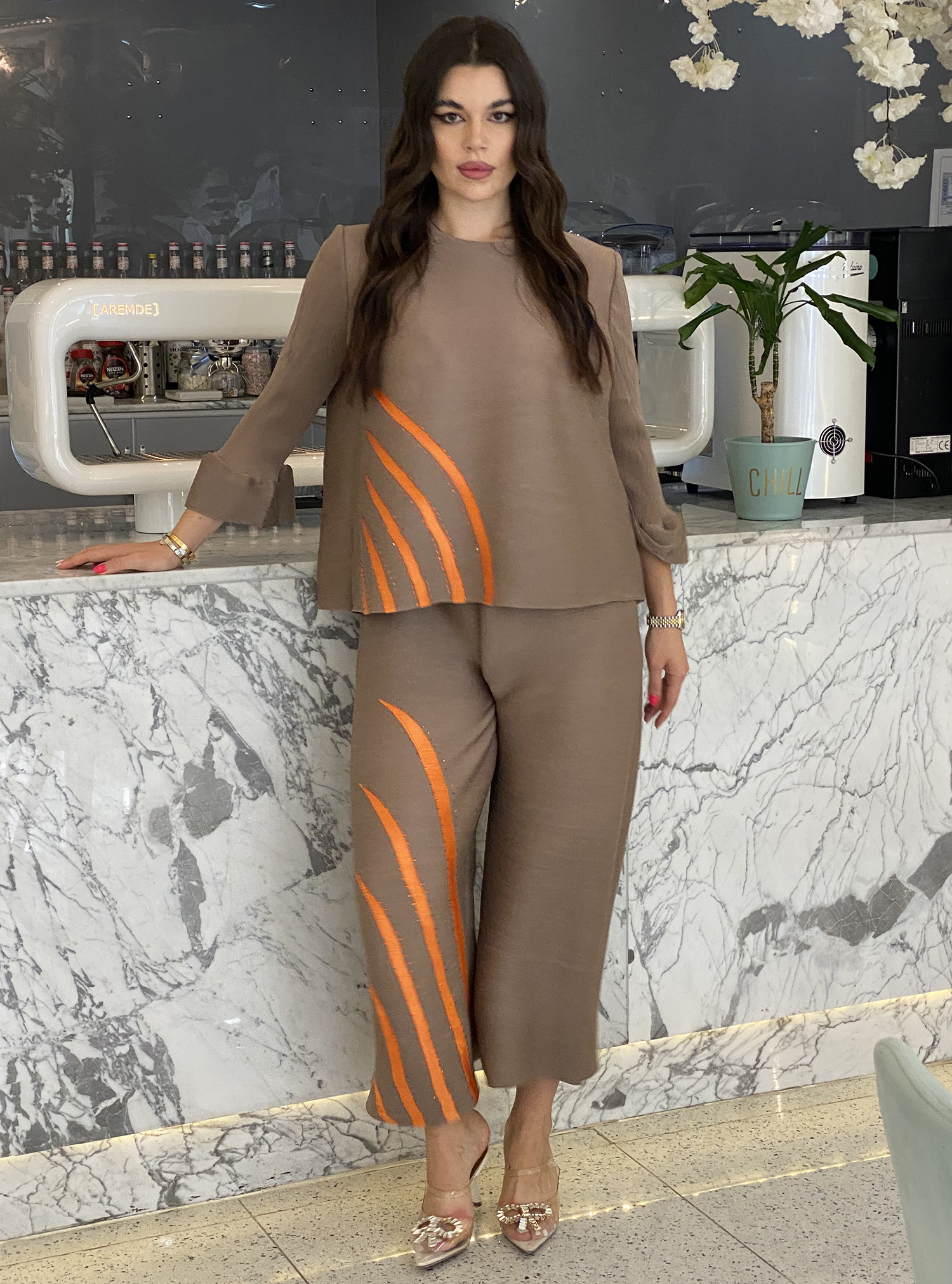 SS23 Travel Set 2-piece travel set featuring an oversized textured blouse and matching wide-leg ...