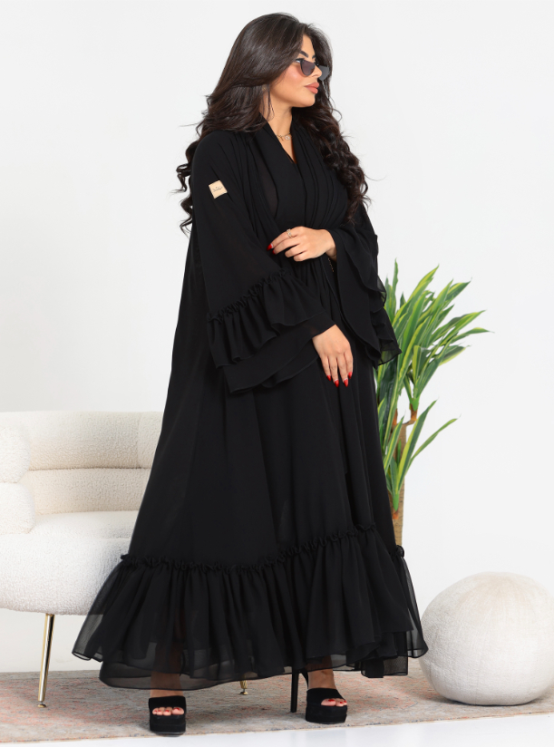 Ruffled Abaya A classic black abaya with ruffle trimmings. Comes with a ...