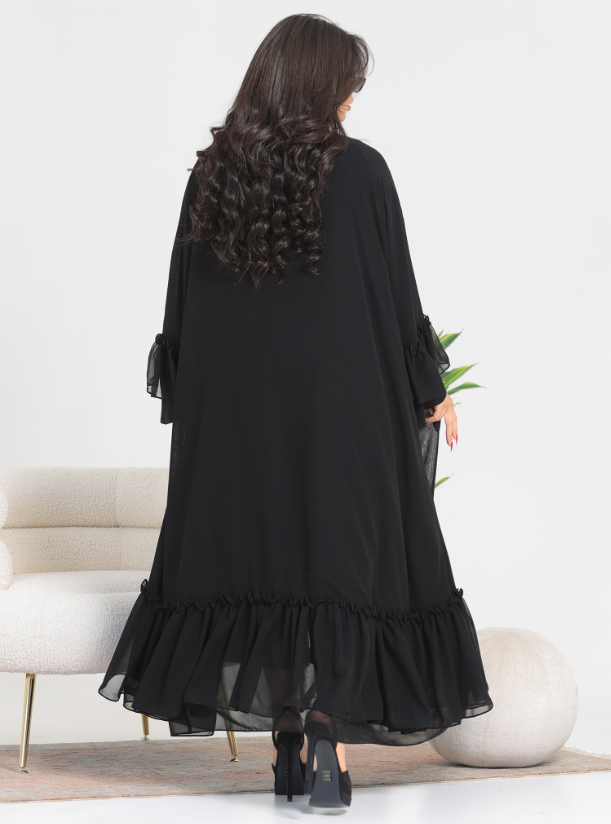 Ruffled Abaya A classic black abaya with ruffle trimmings. Comes with a ...