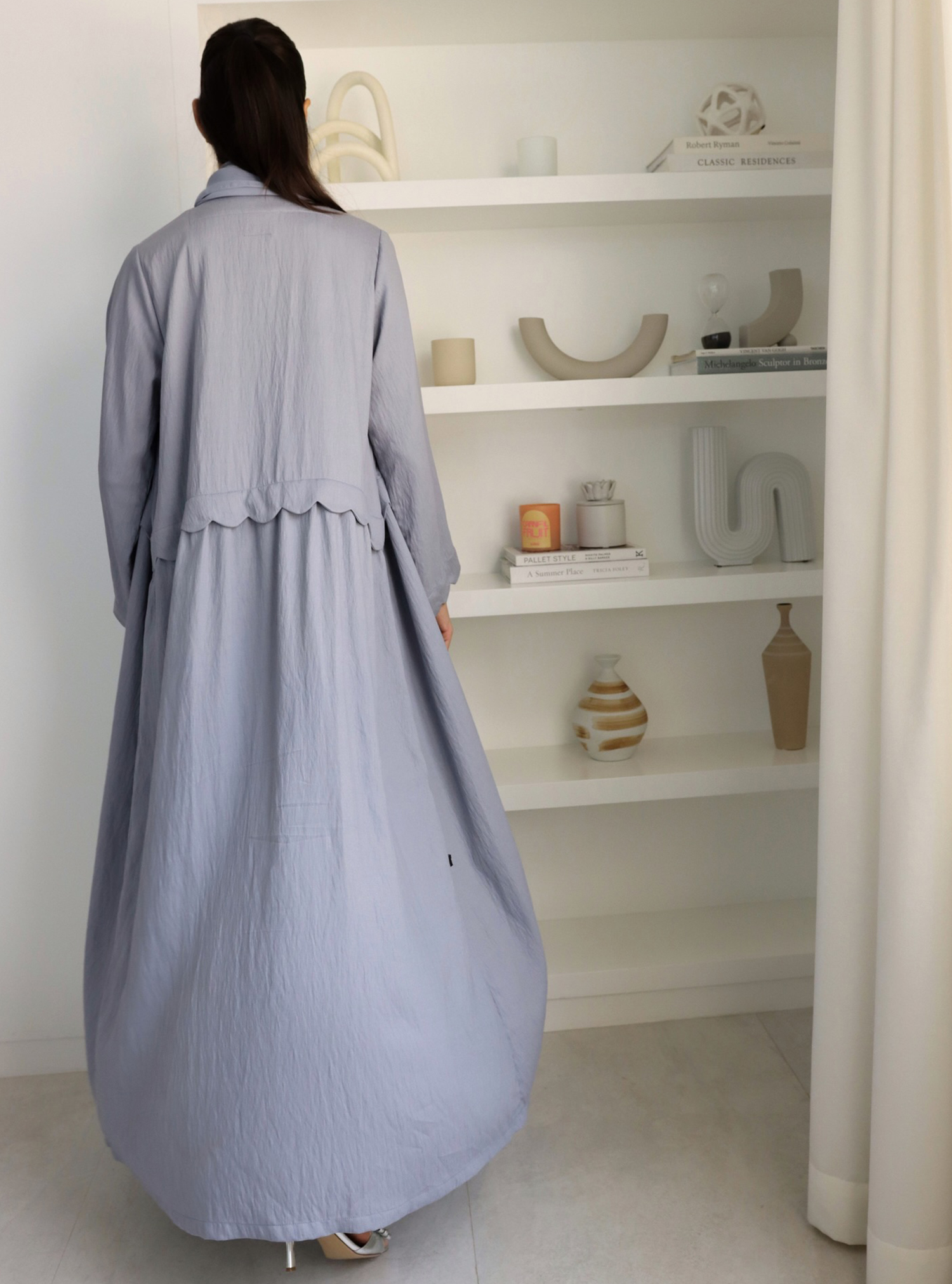 E9 Abaya Casual Abaya Collection, featuring an ash blue minimalist abaya with scallop trimmings ...
