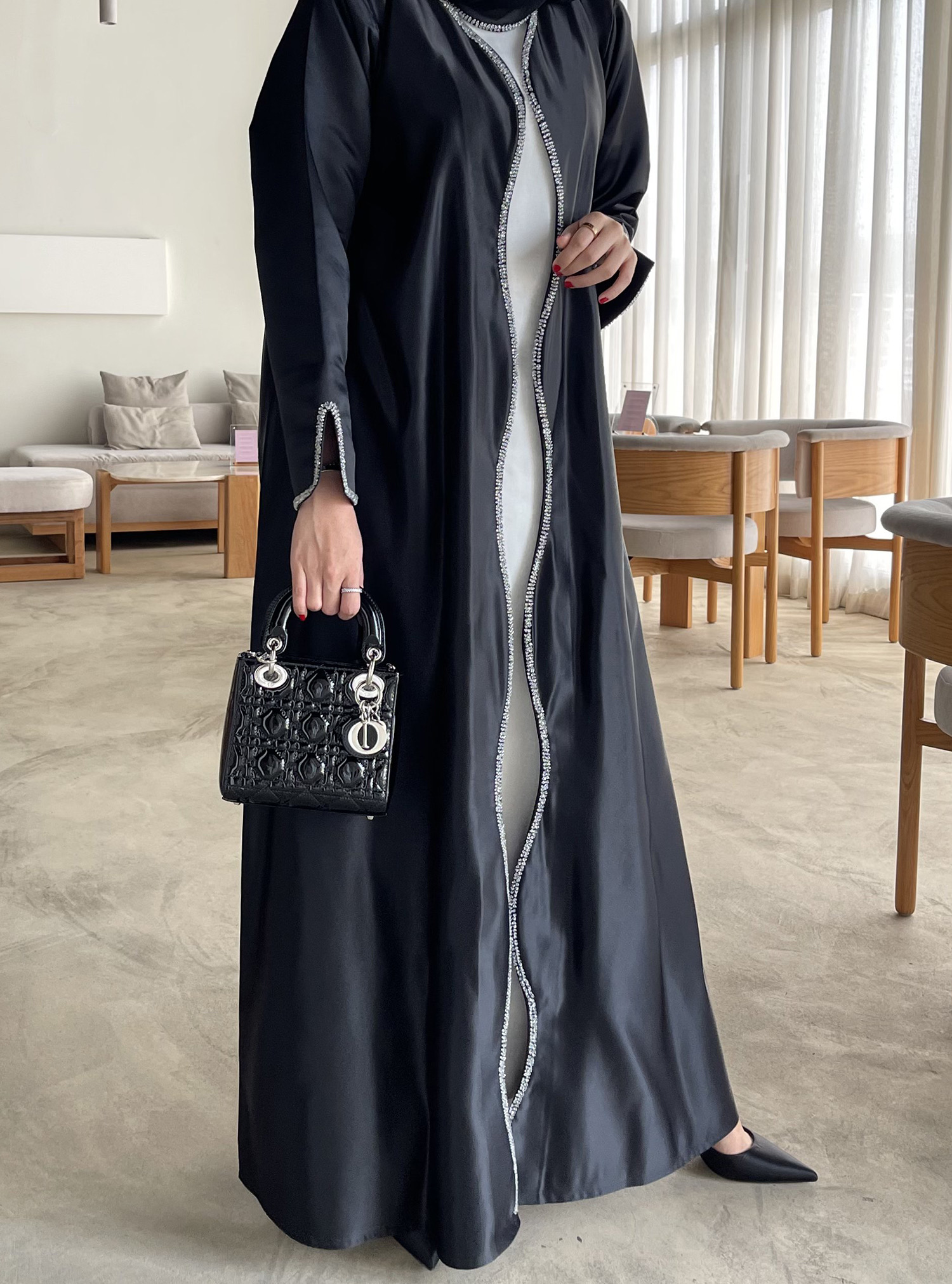 S014 Elevate your elegance with a black satin abaya adorned with ...