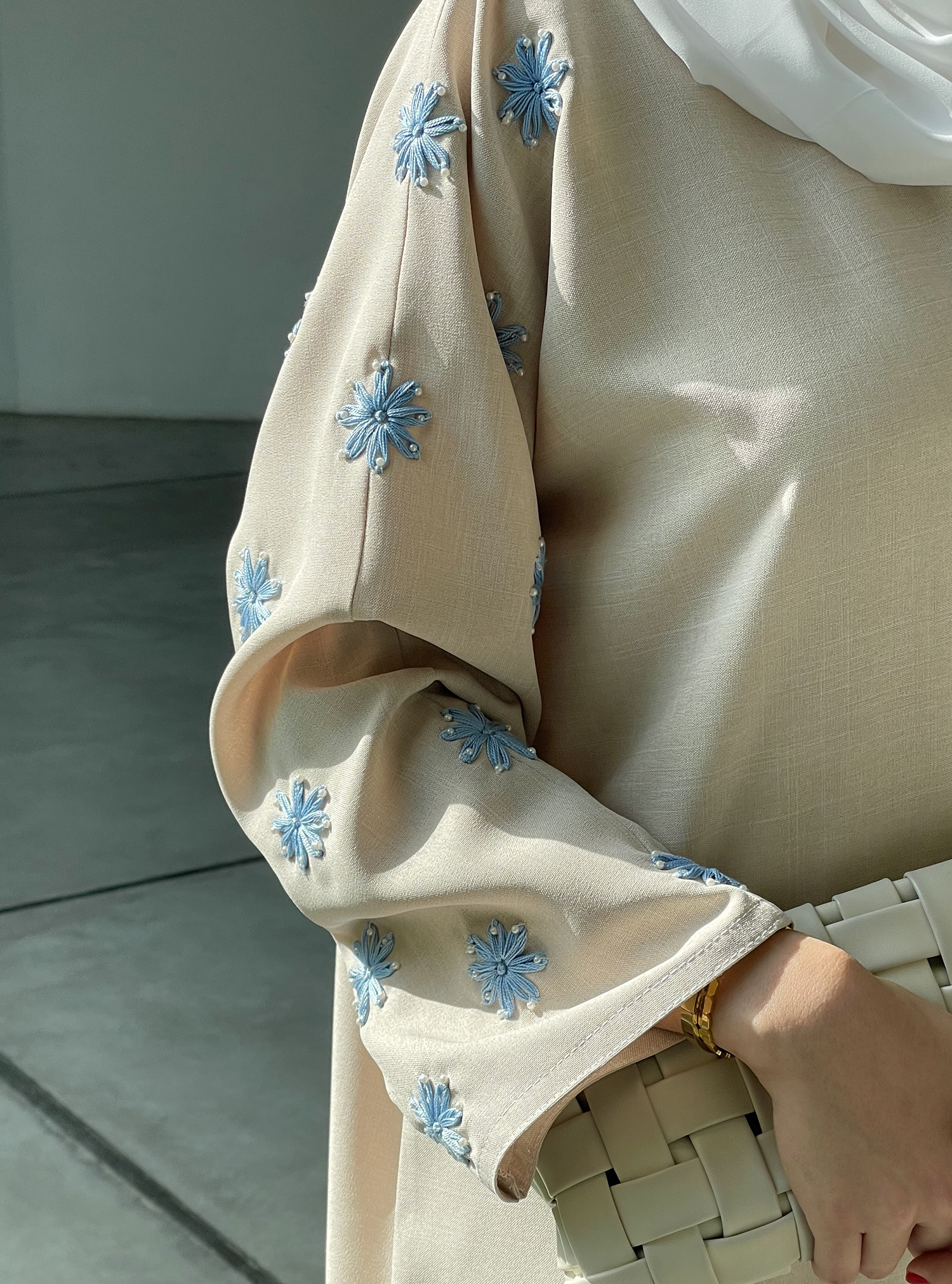 S017 linen beige bisht abaya, adorned with floral delicate baby blue ...