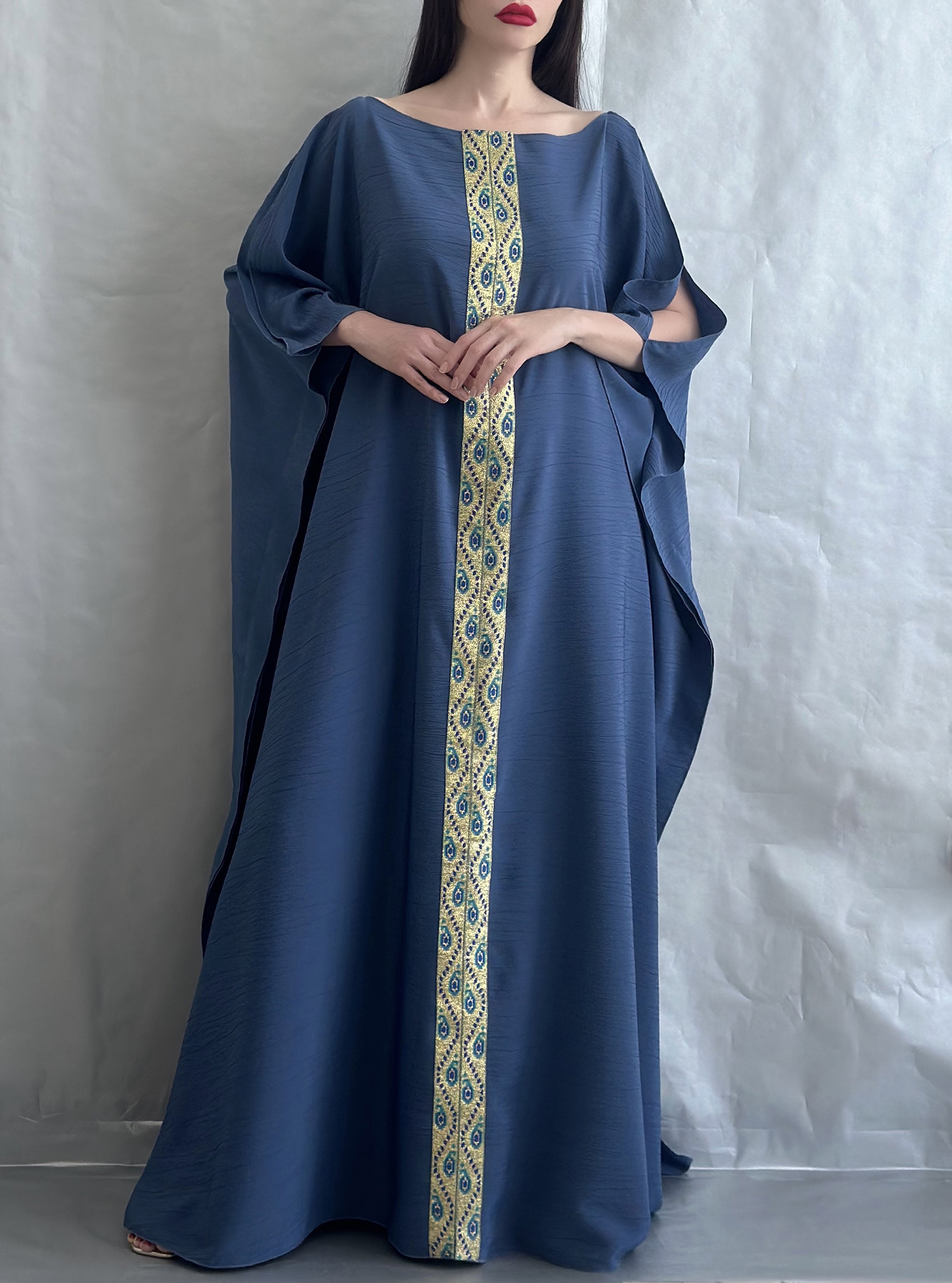 Blue kaftan Blue kaftan with gold embroidery trimmings and side slits ...