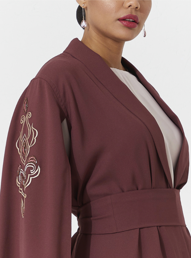 Maroon Royal Maroon abaya with embellished cape sleeves. Comes with an ...