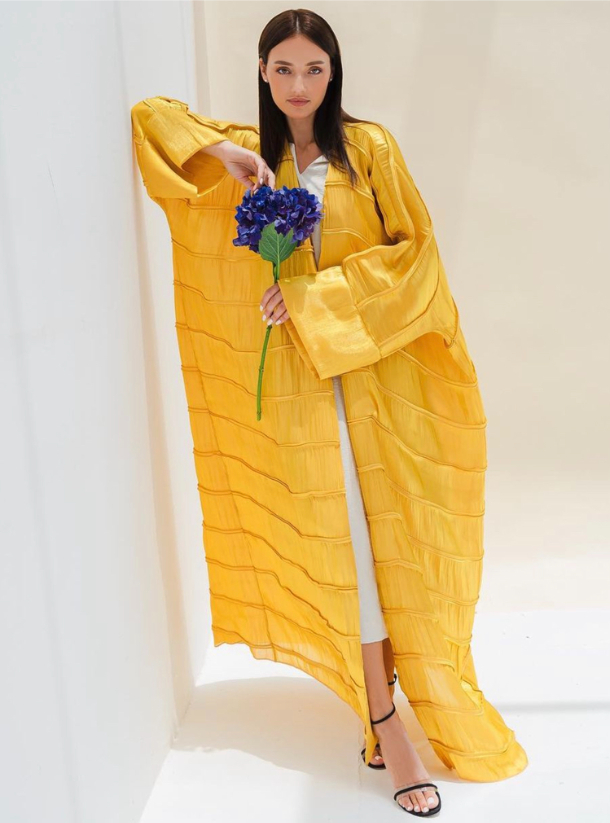 Yellow abaya Yellow organza abaya with piping trimmings. Comes with a ...