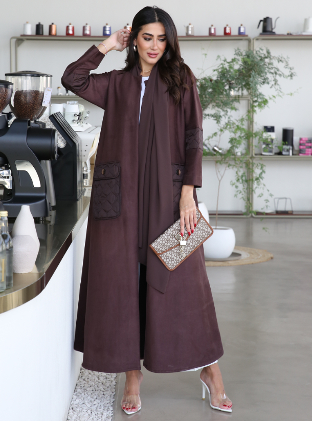 ATO 005 Abaya Brown winter abaya with quilted patch pockets and sleeve details. Comes with a ...
