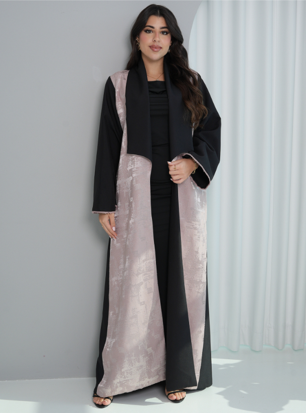 Reversible Reversible Abaya in black and patterned fabric. Abayas from Gharza Couture at Boksha