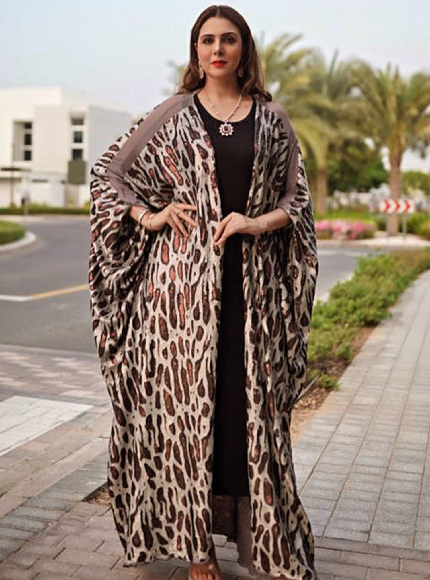 Printed Abaya Free-size printed abaya with a grey matte print and a ...