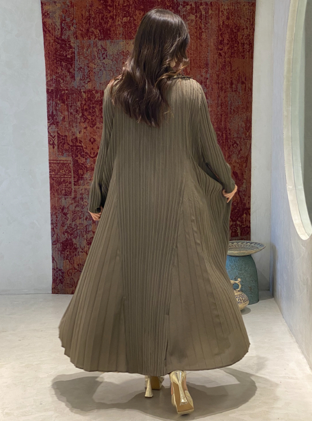 Tt66 A practical and elegant abaya made of a textured and pleated ...