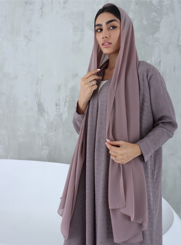 O340 Abaya Casual Abaya Collection, featuring a minimalist contrast stitching and pleat design ...