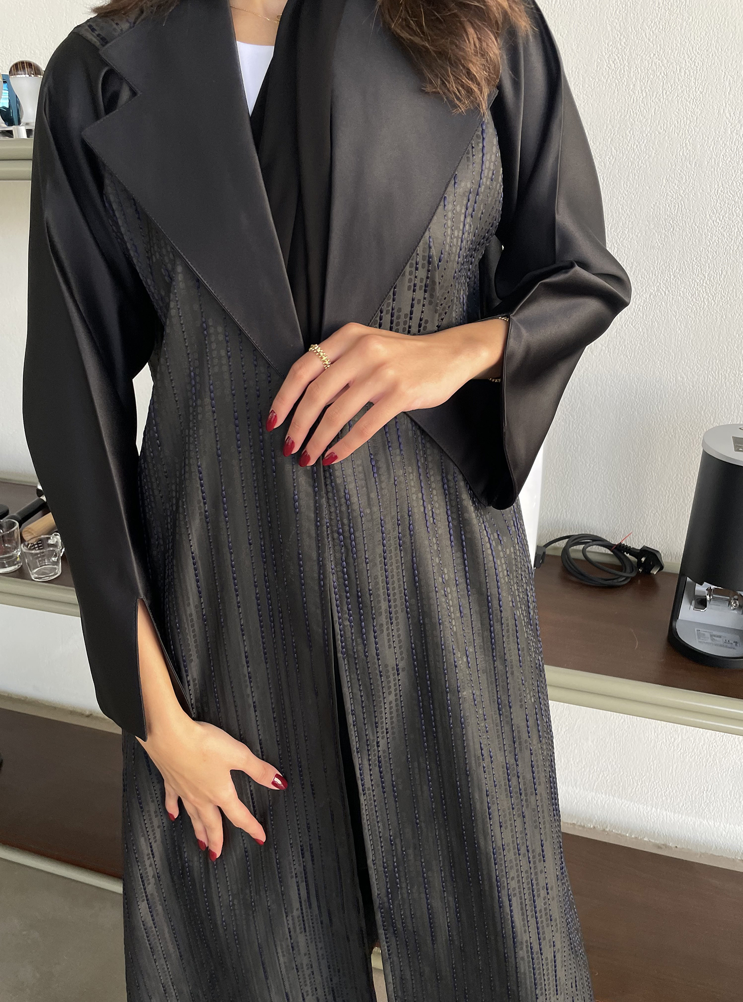 S094 blazer-style abaya, adorned with blue sleek vertical lines for a sophisticated touch ...