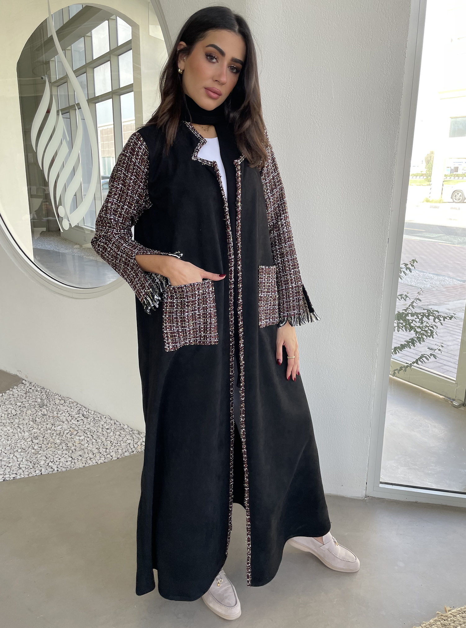 S101 black shamwah abaya featuring daily elegance, adorned with Chanel ...