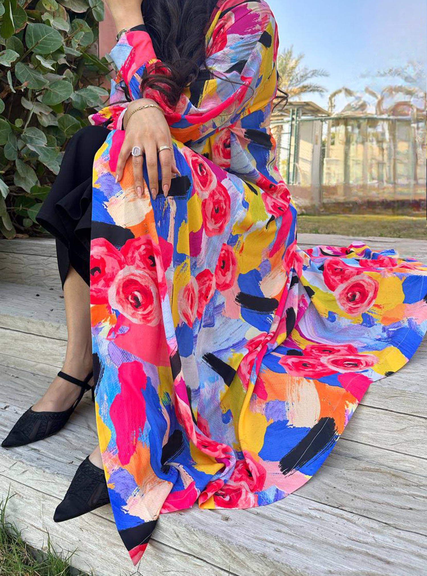 Colored abaya T A light vibrant abaya featuring floral prints, perfect ...