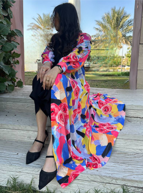 Colored abaya T A light vibrant abaya featuring floral prints, perfect ...