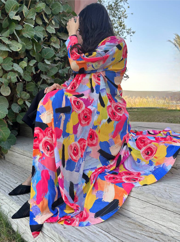 Colored abaya T A light vibrant abaya featuring floral prints, perfect ...
