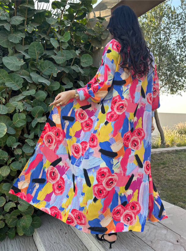 Colored abaya T A light vibrant abaya featuring floral prints, perfect ...