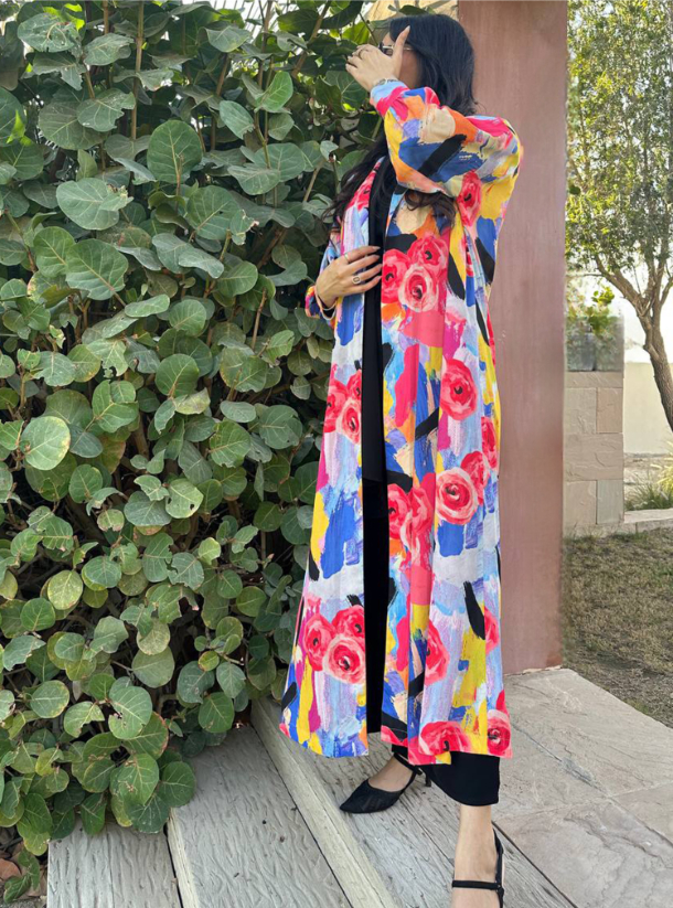 Colored abaya T A light vibrant abaya featuring floral prints, perfect ...